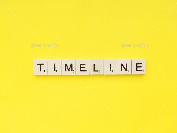 Timeline scrabble letters word on a yellow background Stock Photo by ...