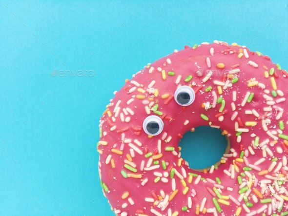 Funny shock face donut on a blue background Stock Photo by margaritaylita