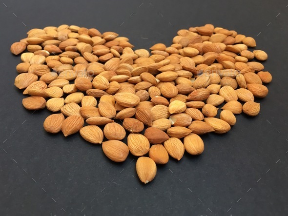 Heart shape nuts Stock Photo by margaritaylita | PhotoDune