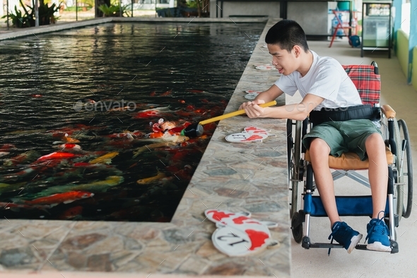 disabled teenager boy on wheelchair doing outdoor activities with fun ...