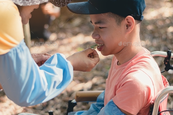 Outdoors activity of smart disabled teenager boy with school of special ...