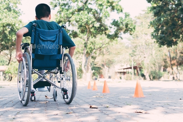 Back of confident disabled teenager boy with skill of occupational ...