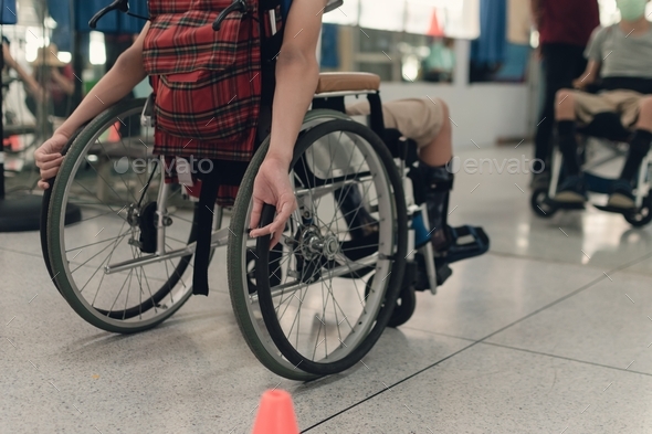 Asian disabled child on wheelchair intend with skills development a ...