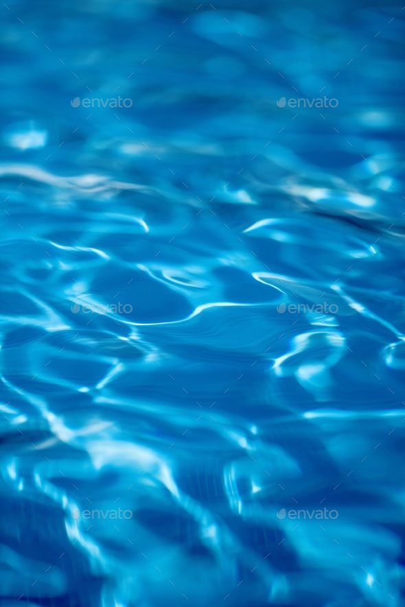 textured sea water background from azure and light blue sea depths with ...