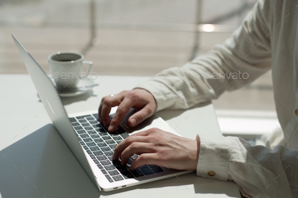 Creative male with internet technology and hands typing on laptop ...