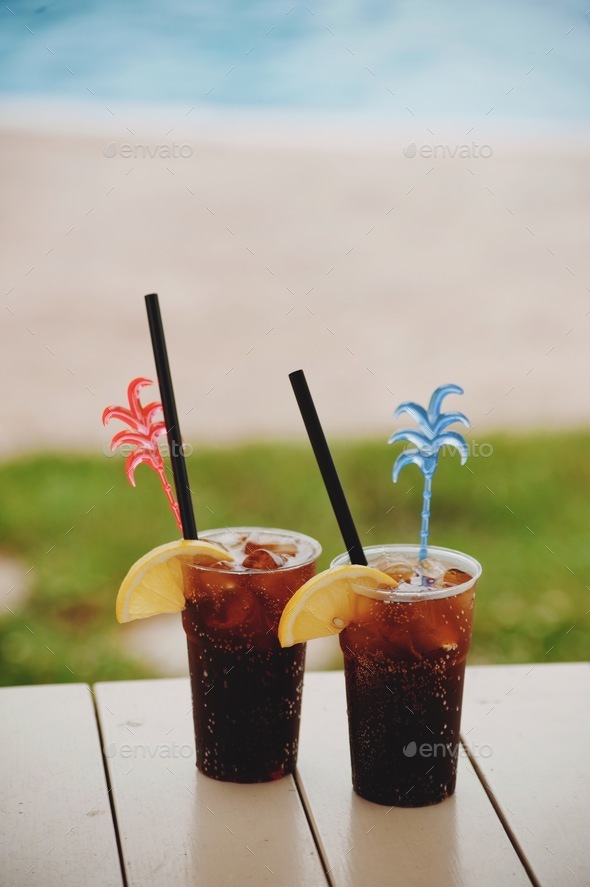 Summertime a couple of cocktails with coca cola in the recreation area ...