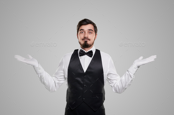Elegant waiter with clueless confused gesture Stock Photo by kegfire