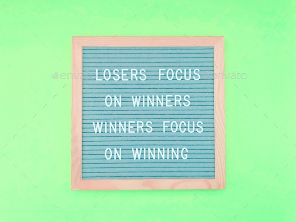 Losers focus on winners. Winners focus on winning. Quote. Stock Photo ...