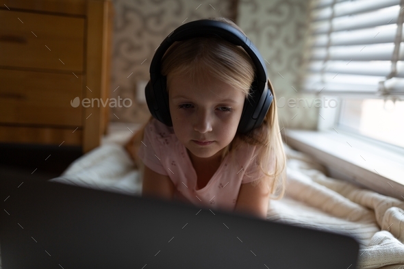 Kid having online lesson at home during coronavirus covid-19 pandemic ...