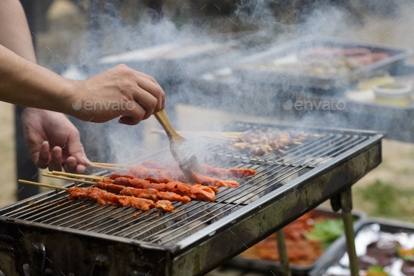 Man’s hands cooking barbecue on backyard at hot summer day Stock Photo ...