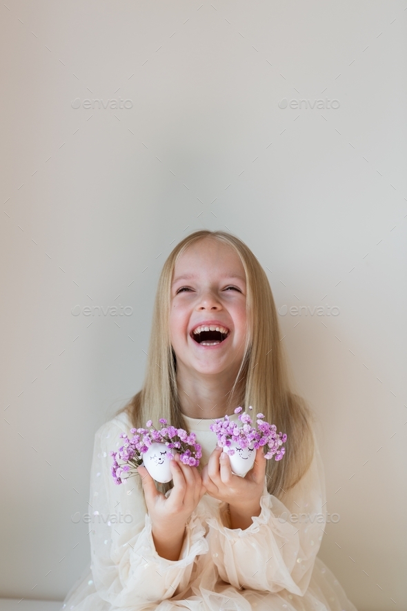 Caucasian kid 7 years old holding hands Cute Easter eggs with drawn ...