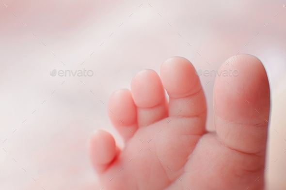 Caucasian Newborn baby foot closeup macro detail shot. child portrait ...