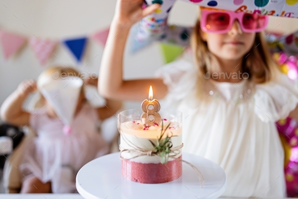 Birthday party at home. Happy little caucasian girl and cute baby ...