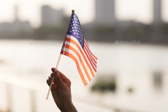 Hand holding American flag. Happy independence day or memorial day ...
