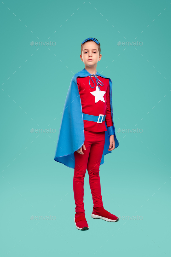 Confident superhero kid in superhero costume Stock Photo by kegfire