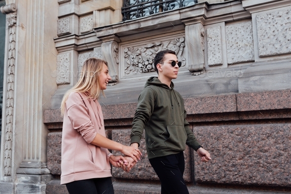 Young millennial or generation z couple in love walking outdoor at ...