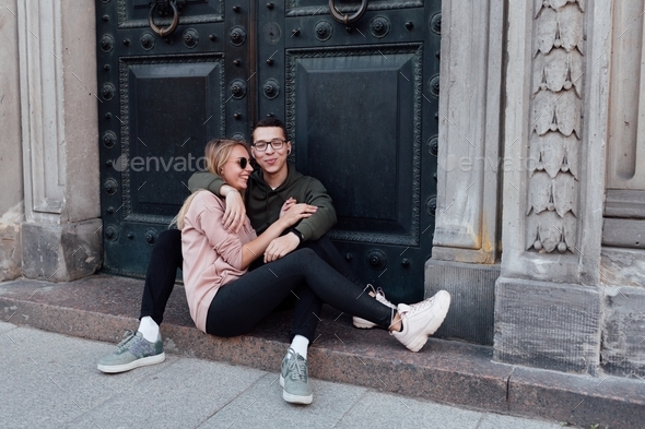 Young millennial or generation z couple in love hugging outdoor at ...