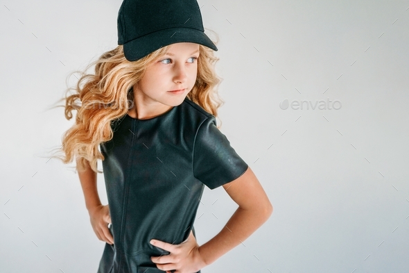 Beauty fashion portrait of smiling curly hair tween girl in black ...
