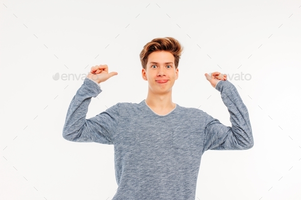 Smiling young guy welcomes saying goodbye to hand on white background ...