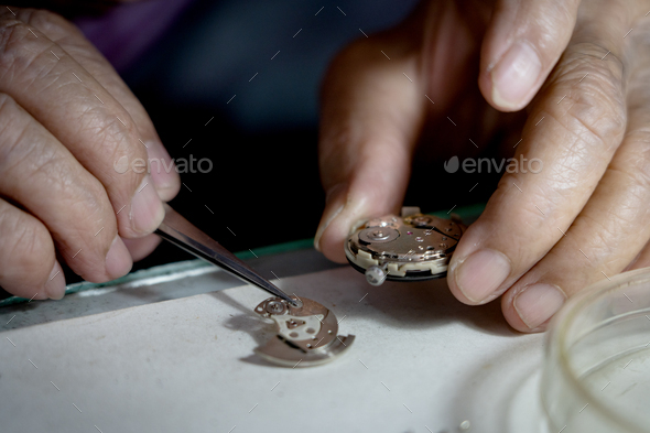 Watchmaker is repairing the mechanical watches in his workshop Stock ...
