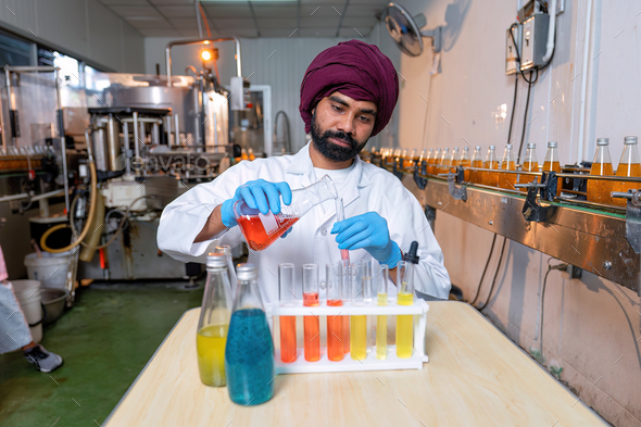 Beverage laboratory room worker in drink factory take product sample to ...