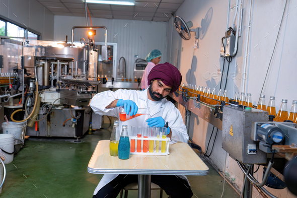 Beverage laboratory room worker in drink factory take product sample to ...