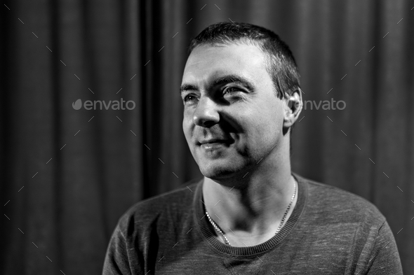Black and white portrait of a young man with hard light.Dramatic face ...