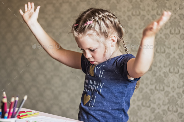 Girl solves math examples in class at school Stock Photo by svetlaya_83