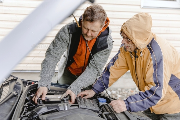 Auto mechanics, Caucasian White mans, working in a car repair shop ...