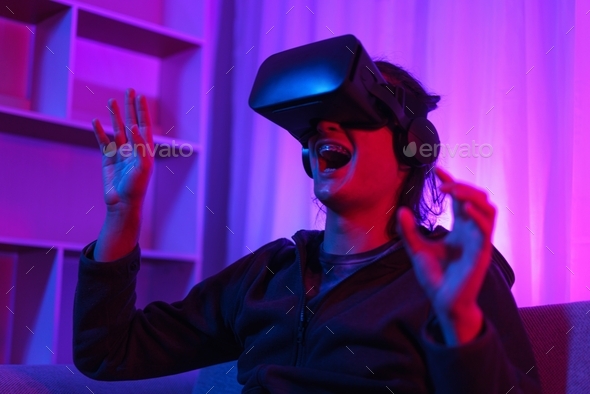 Metaverse technology concept, Man wear VR goggles and have fun to touch ...