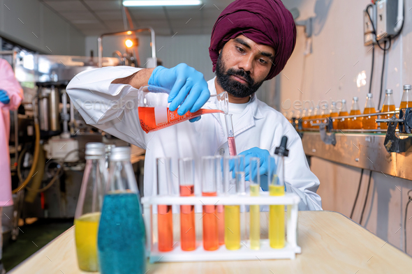 Beverage laboratory room worker in drink factory take product sample to ...