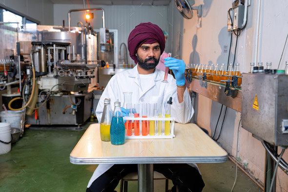 Beverage laboratory room worker in drink factory take product sample to ...