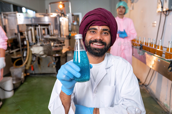 Beverage laboratory room worker in drink factory take product sample to ...