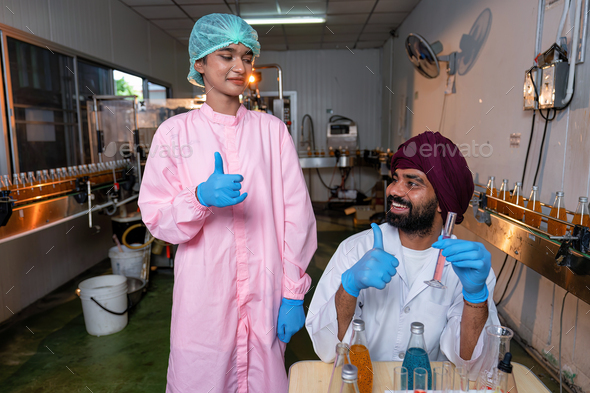 Beverage laboratory room worker in drink factory take product sample to ...