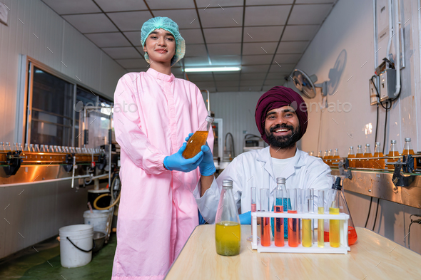 Beverage laboratory room worker in drink factory take product sample to ...