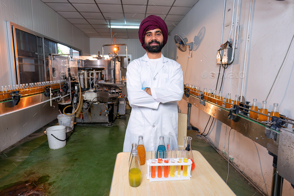 Beverage laboratory room worker in drink factory stand hold product ...