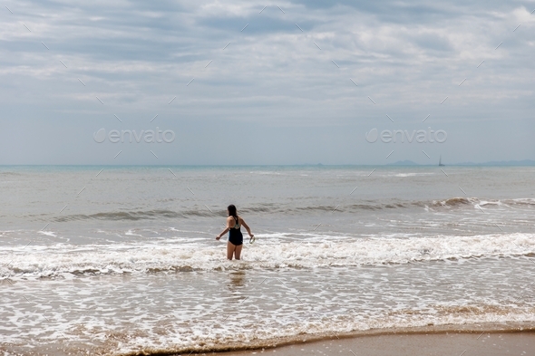 Teenage girl swimming in sea water Stock Photo by elenakaretnikova2022