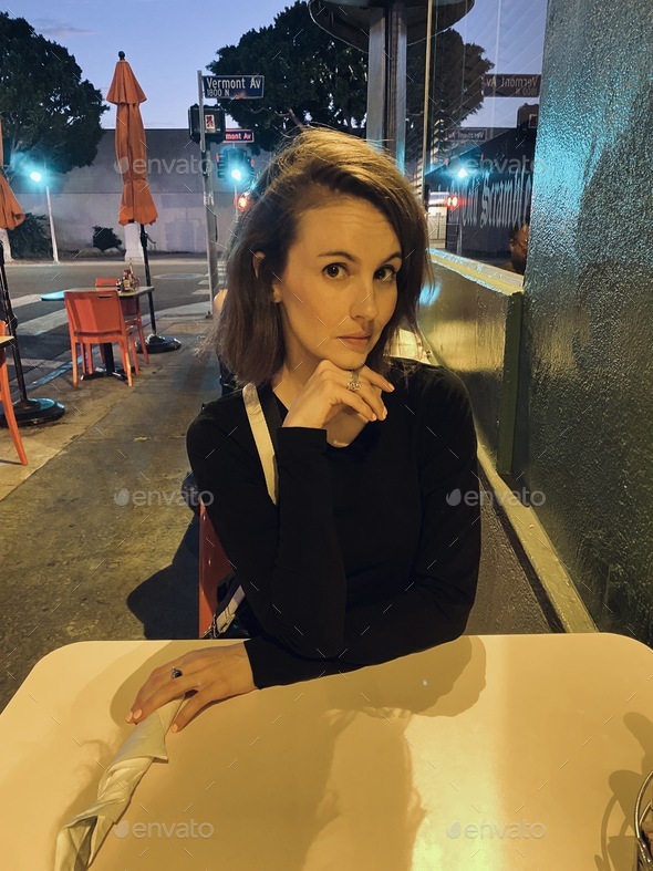 A woman sits across the table at a restaurant in los angeles california ...
