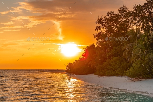 picturesque sunrise in the Maldives island Stock Photo by klavdiyav