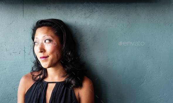 Asian woman showing her emotions at happy hour considering that cosmo ...