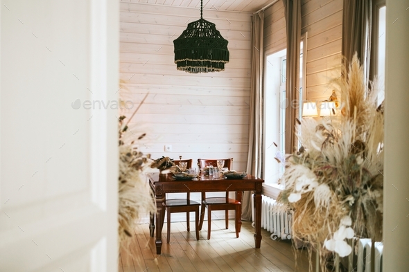 rustic wooden country cozy house, view through the doors to the living ...