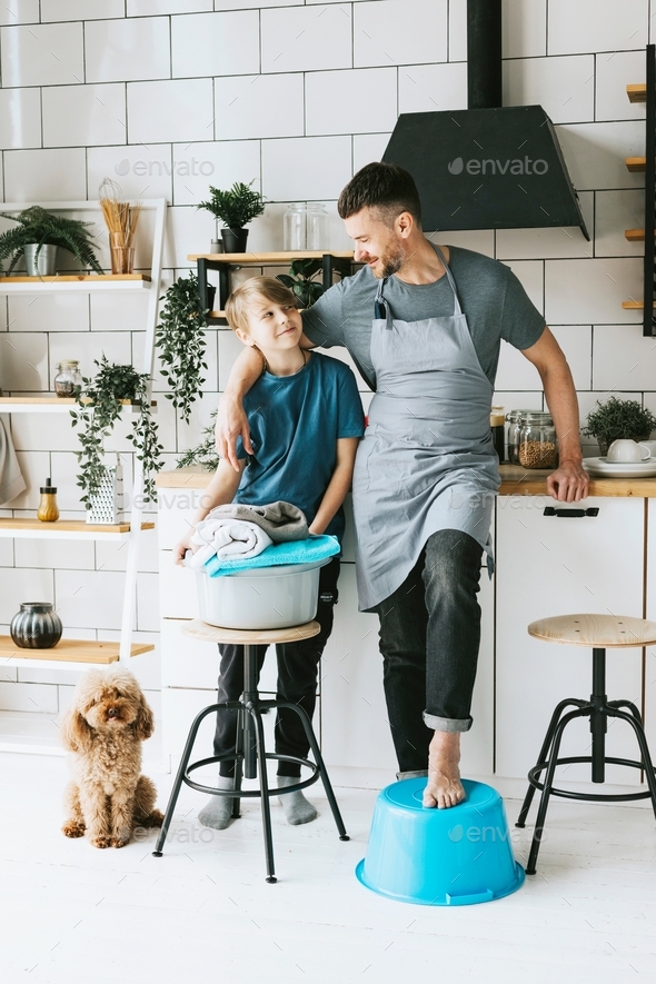 Doing chores dad and son Stock Photo by klavdiyav | PhotoDune