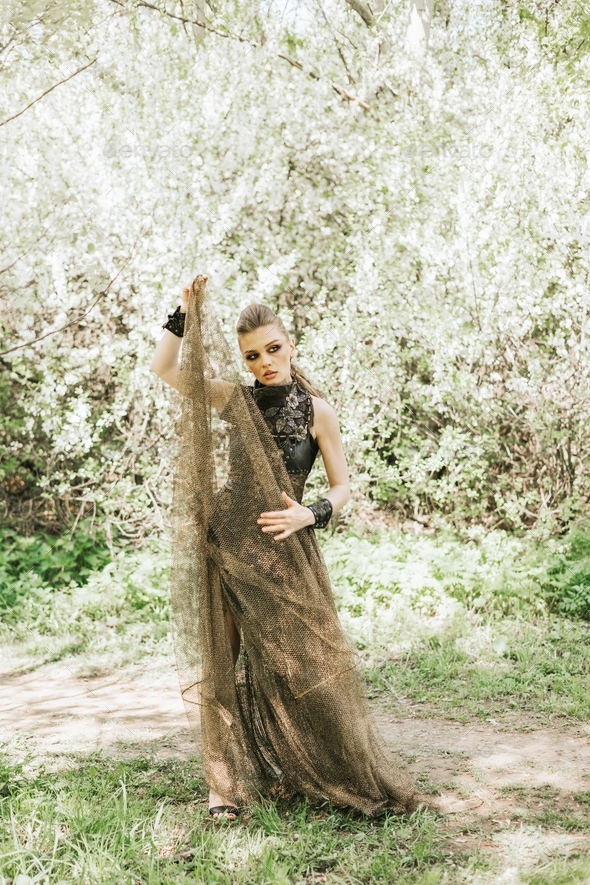 young beautiful warrior girl woman in amazon clothes or medieval ...