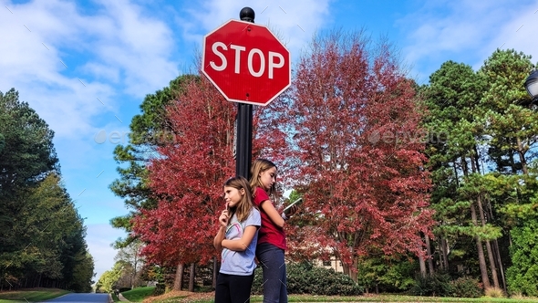 Candids in public places leaning on traffic signs of stop for people in ...