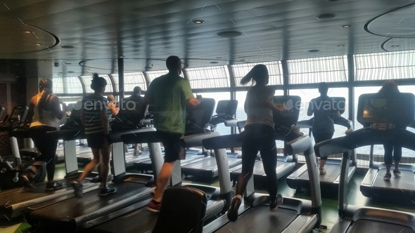 Fitness on beach vacation with a sea view on motorized treadmills in ...