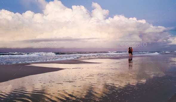 Beautiful sky with clouds reflected in the surf in seascape of ocean ...