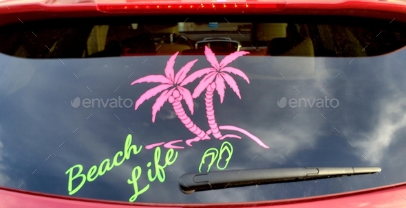 Decals on car windshield say beach life with flip flops at a Palm party ...