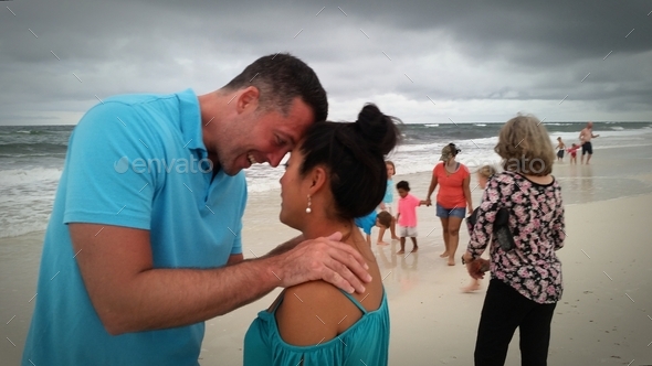 Generation X couple having a funny conversation in candids in public ...