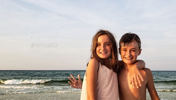 People at the beach as candid portraits of happy people on seashore on ...