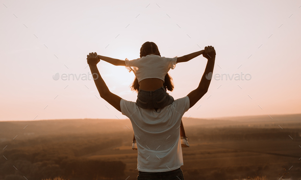 Anonymous father with daughter during sunset in nature Stock Photo by ...